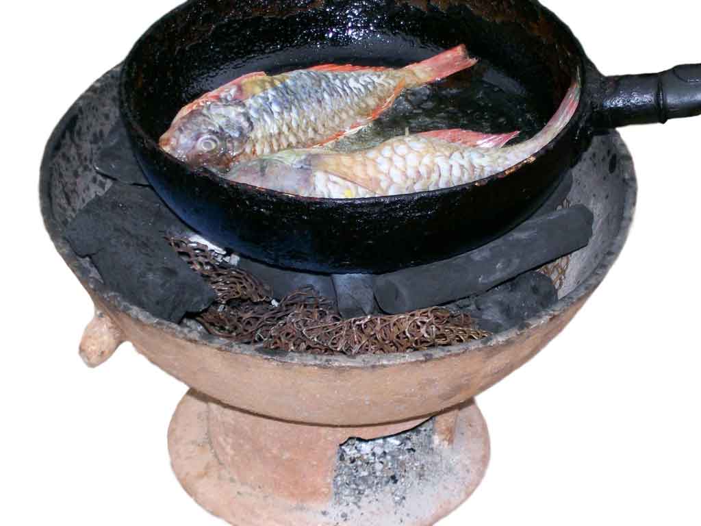 Cooking on a Bajan cast iron coal pot stove - BajanThings