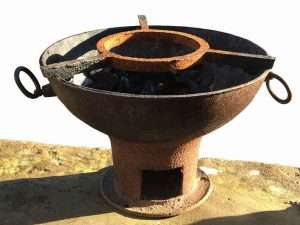 Cooking on a Bajan cast iron coal pot stove - BajanThings